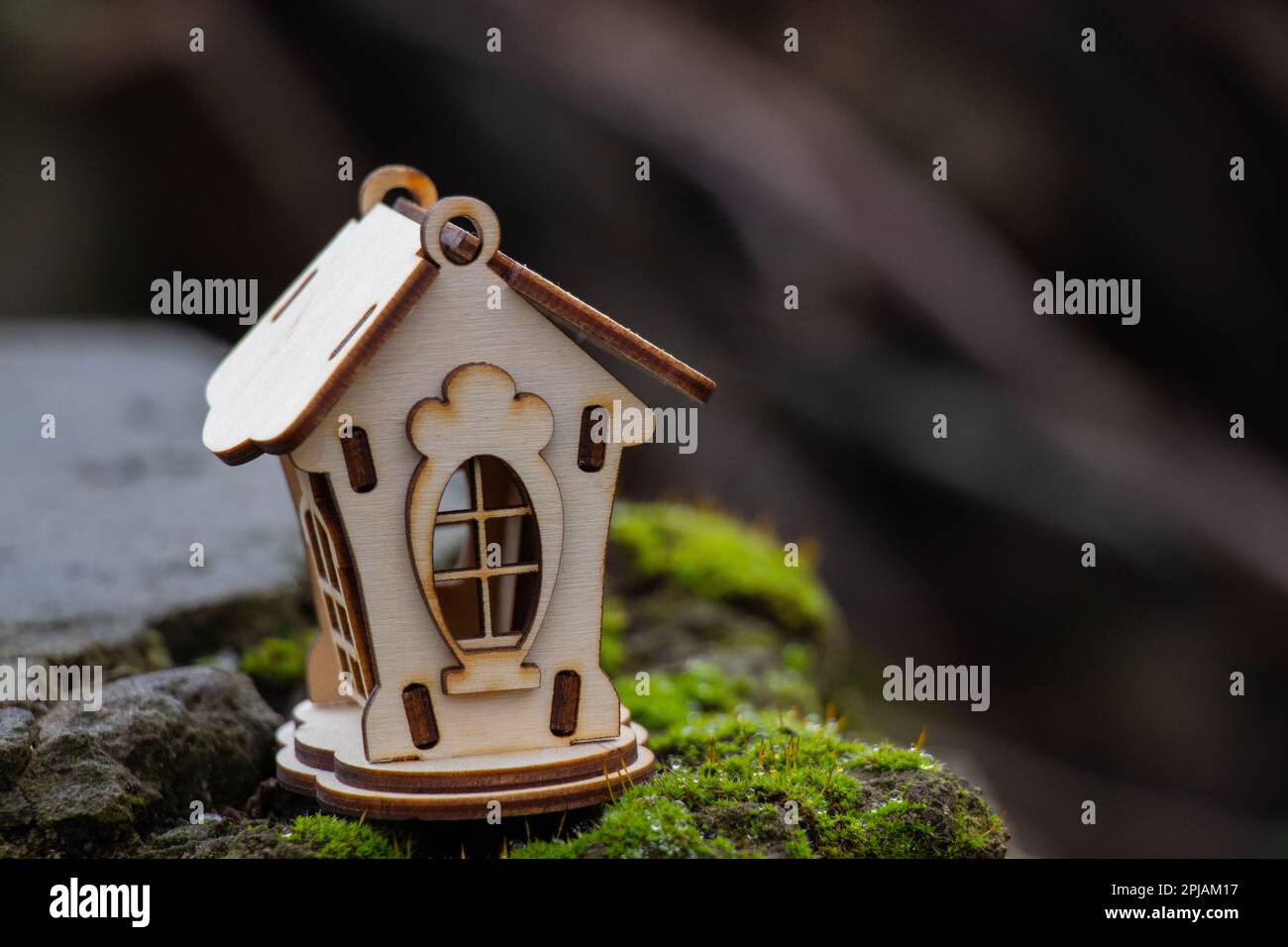 small wooden stone house with moss Stock Photo - Alamy