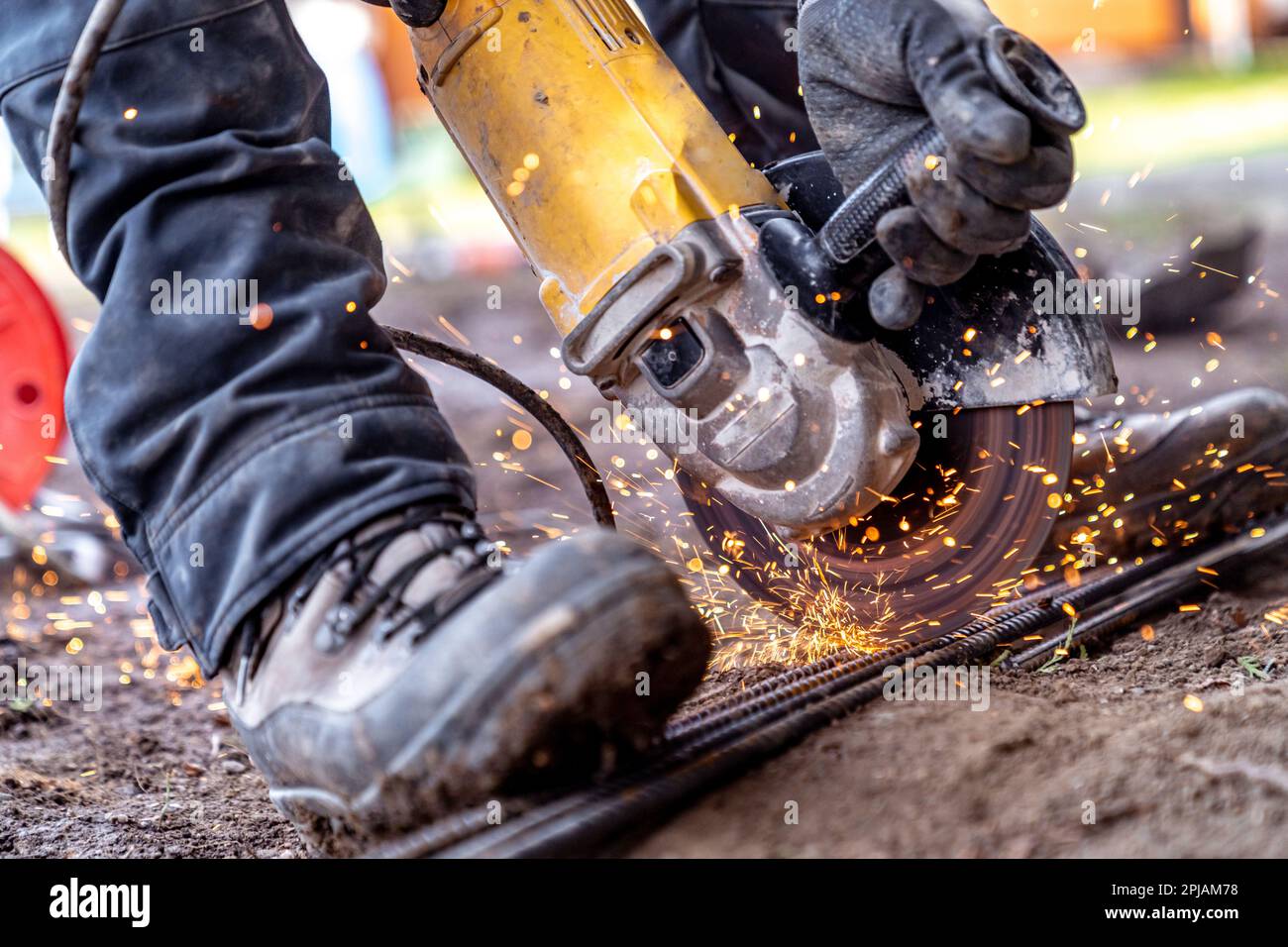 cutting iron fittings with a grinder Stock Photo - Alamy
