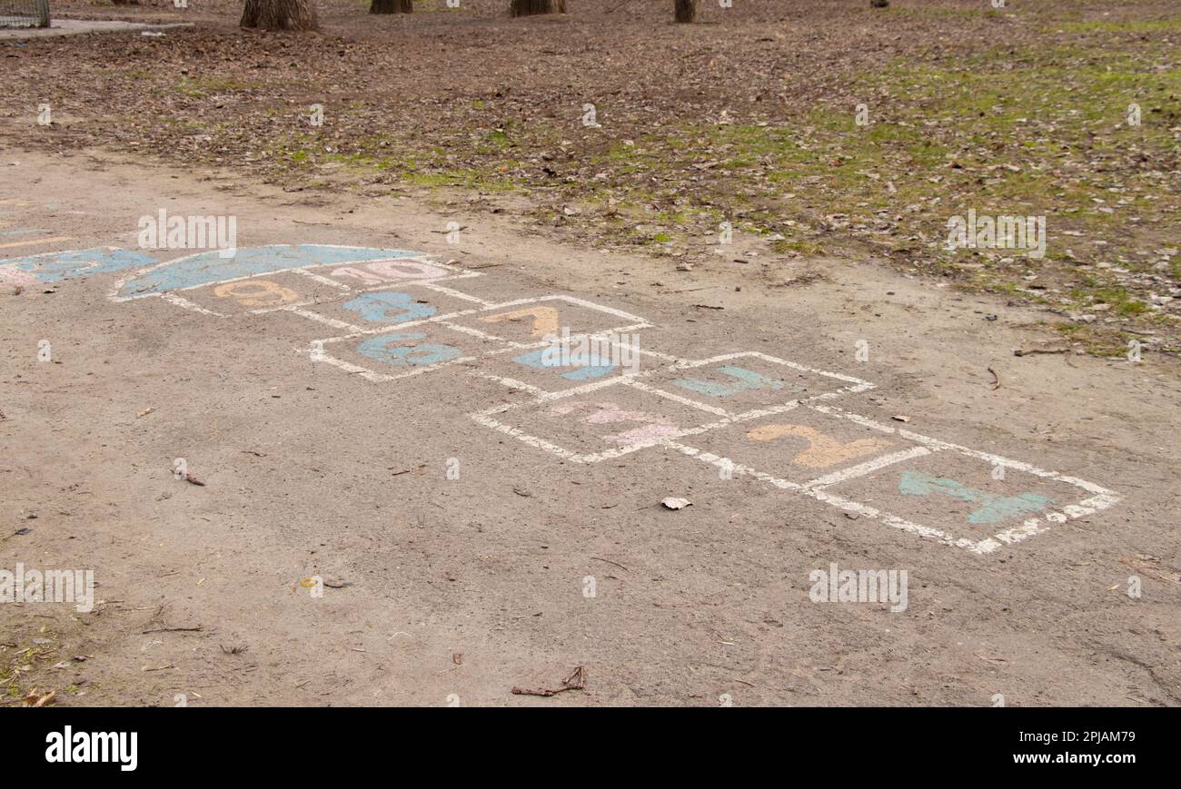 children's game on the asphalt, numbers are painted on the asphalt with ...
