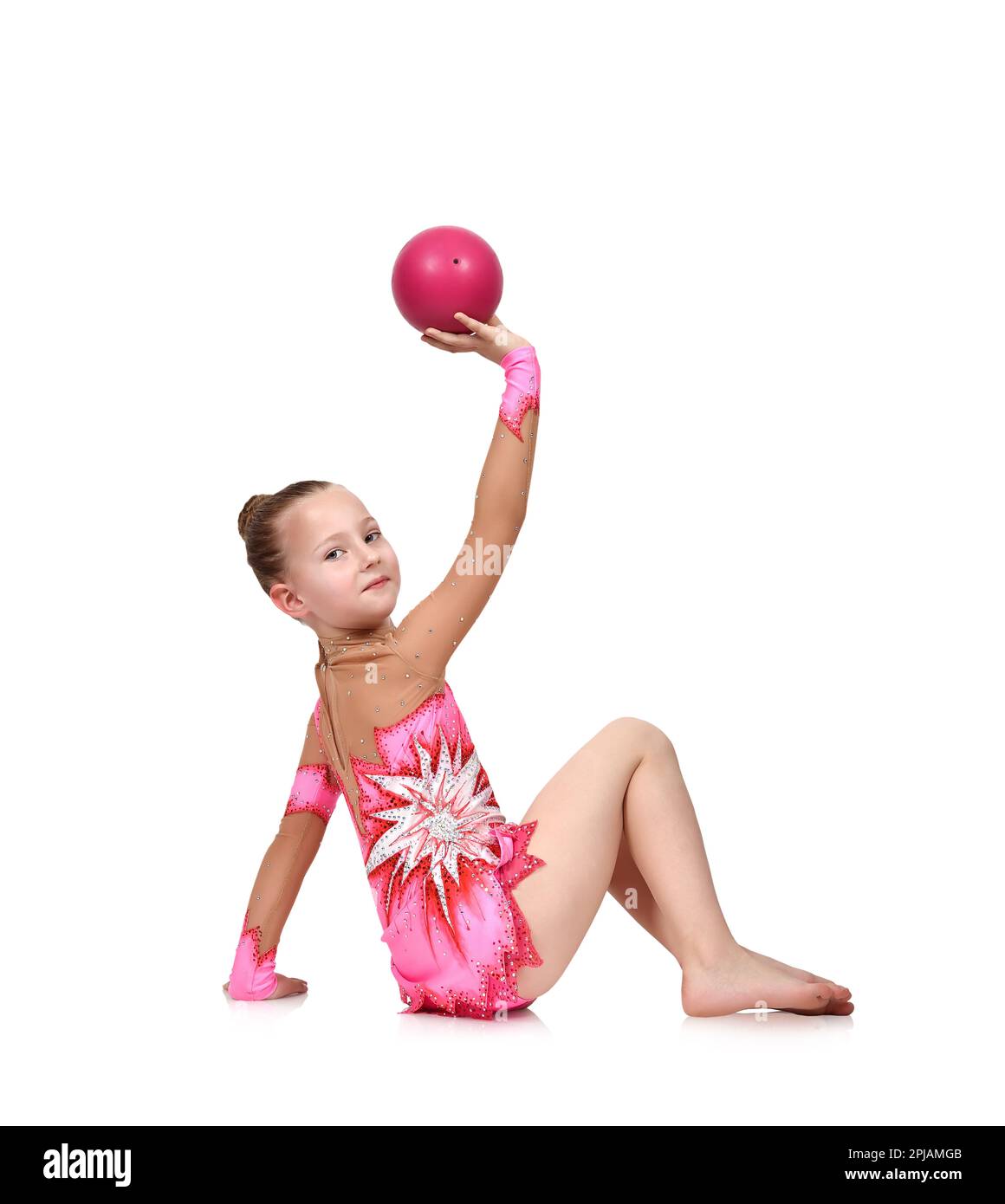 Little girl gymnast posing with the ball, isolated on white Stock Photo ...