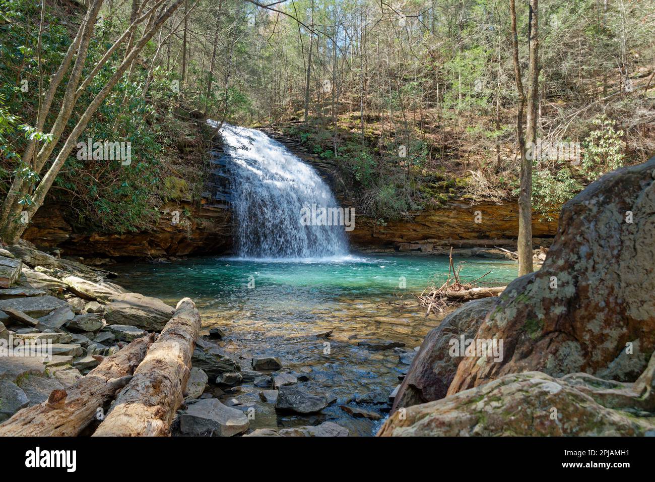 A full view of the flowing waterfall cascading into a turquoise color ...