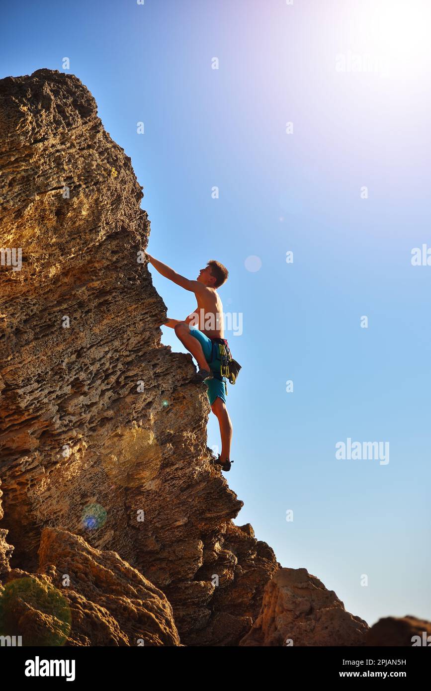 Traveler climbing up on hill hi-res stock photography and images - Alamy