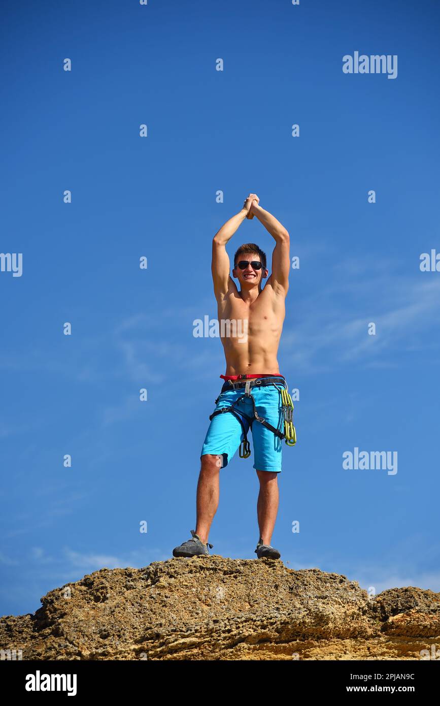 Male Climber Raising Hands On The Top Of Mountain. Concept Of Success ...