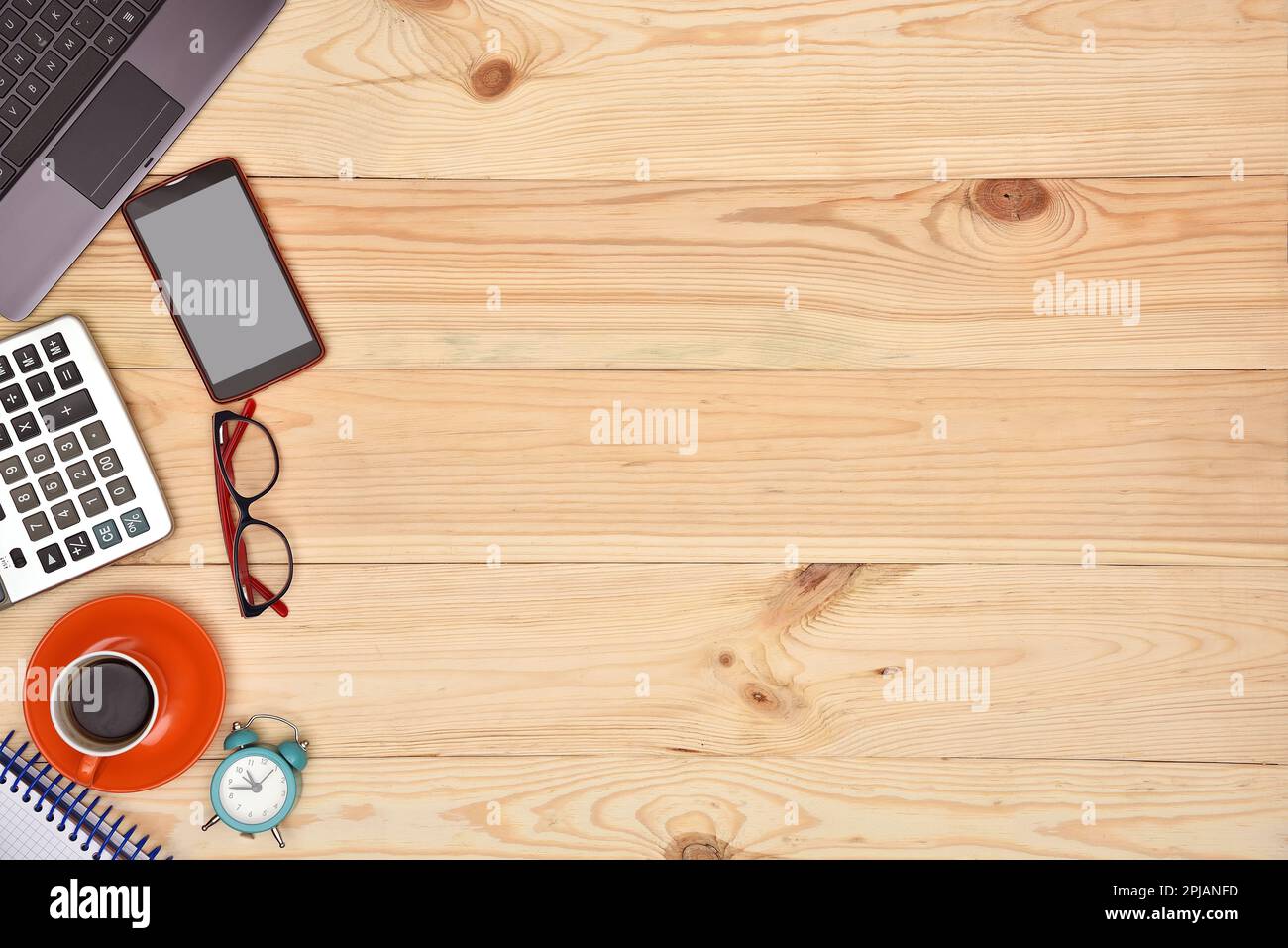 Laptop and material office desktop on wooden desk, top view Stock Photo ...