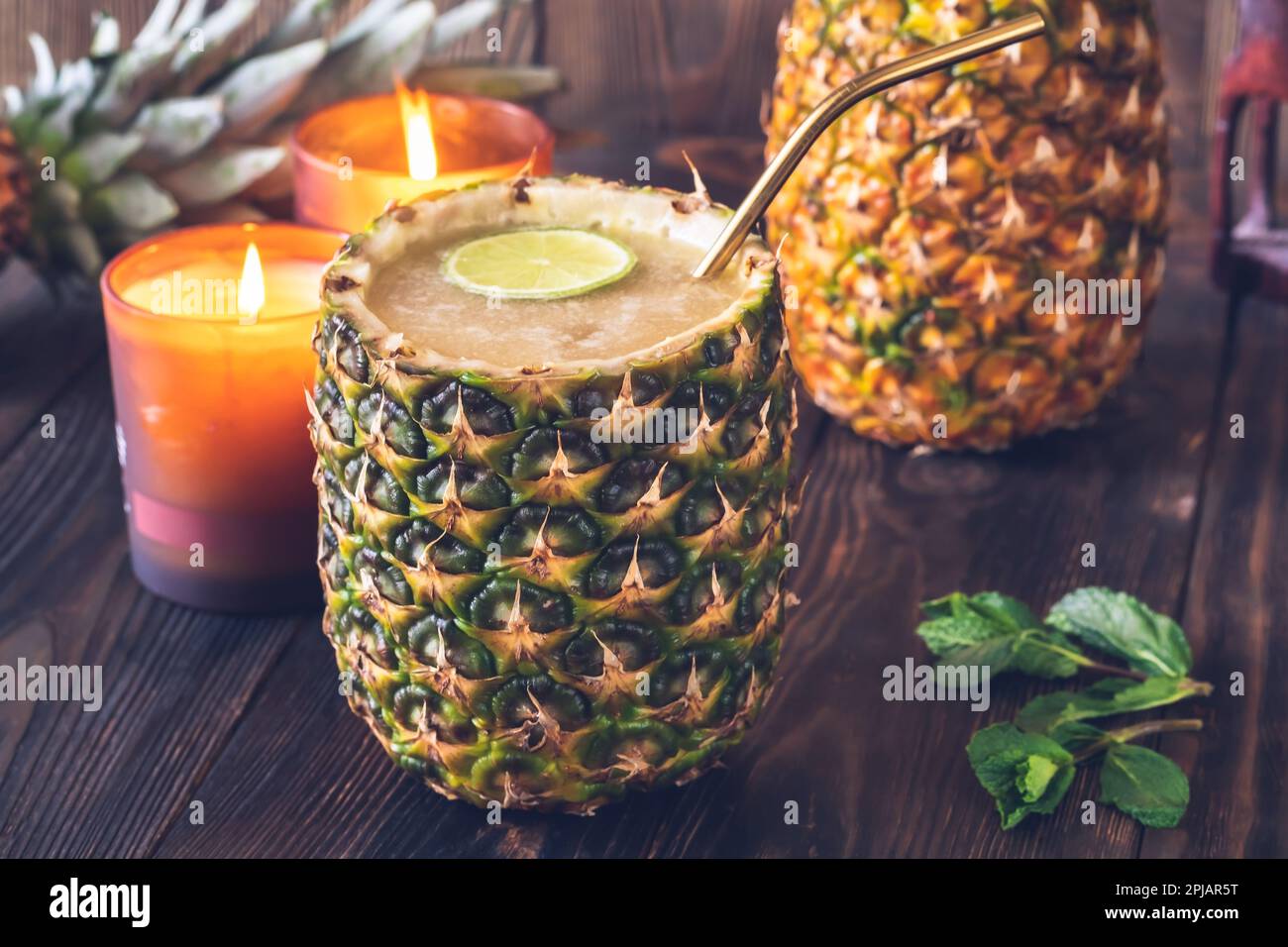Abacaxi Ricaco cocktail served on pineapple shell Stock Photo - Alamy
