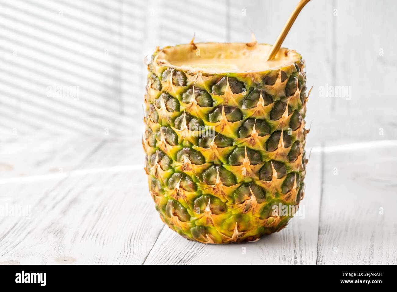Greek Pina Colada cocktail served in pineapple shell Stock Photo - Alamy