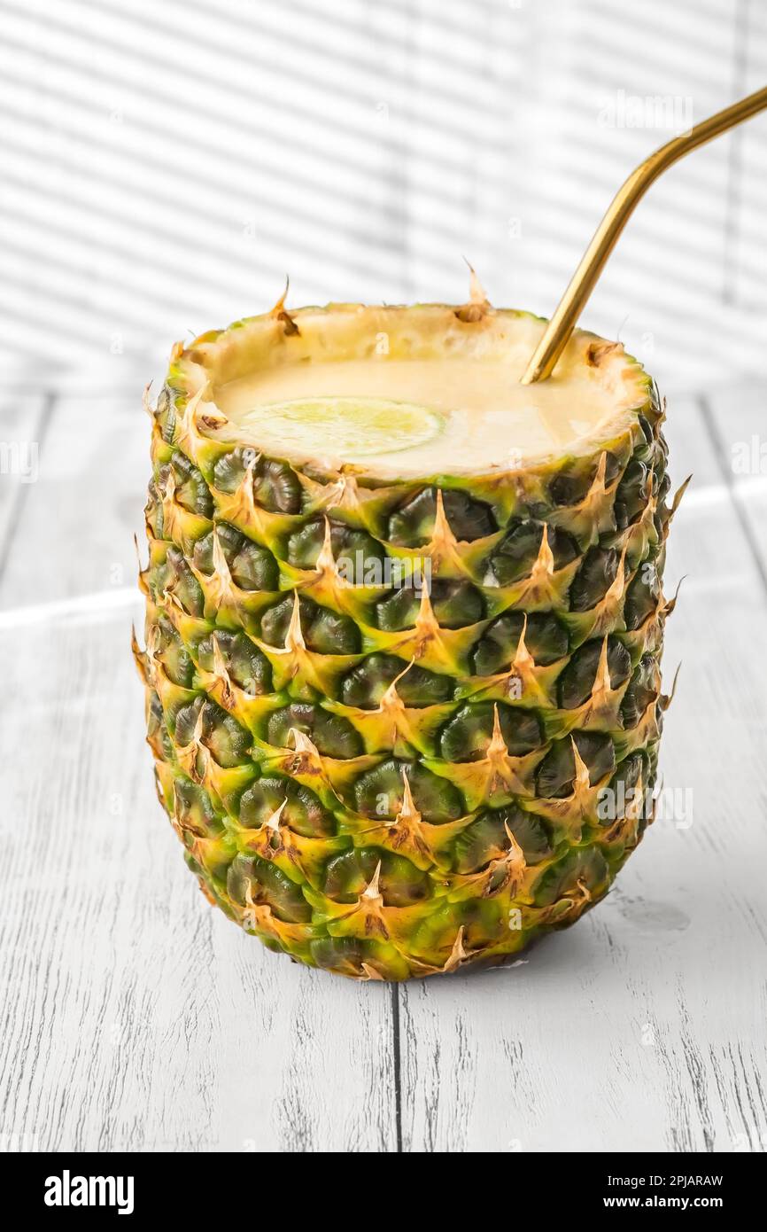 Greek Pina Colada cocktail served in pineapple shell Stock Photo - Alamy