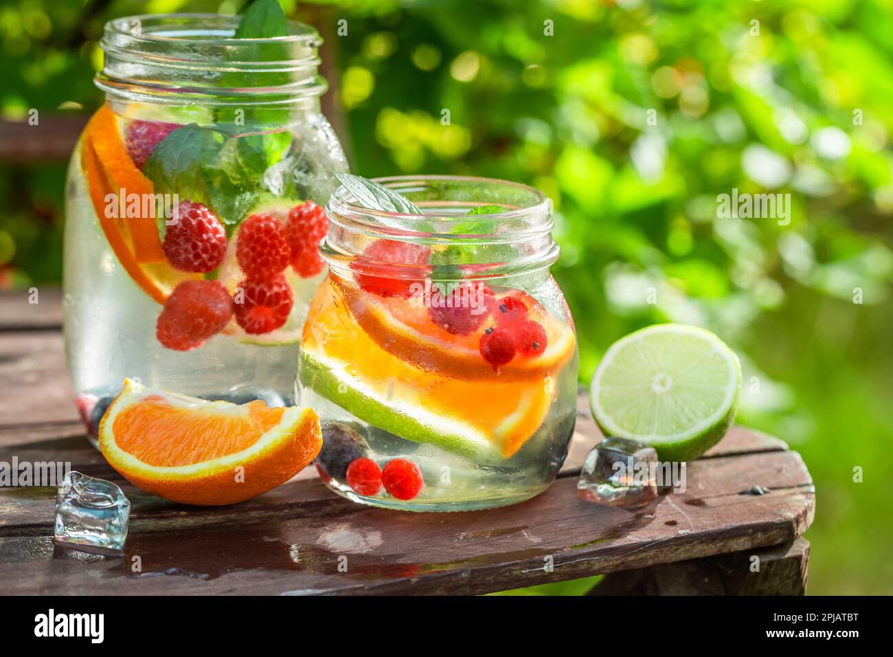 Fresh and sweet lemonade made of summer fruits. Cold fruit lemonade in ...