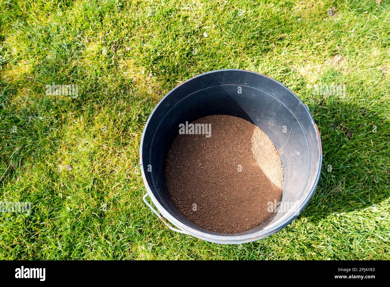 Lawn feed bucket hi-res stock photography and images - Alamy