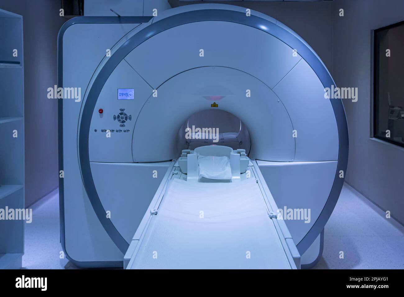 Modern hospital Computed Tomography room interior with device. Computer ...