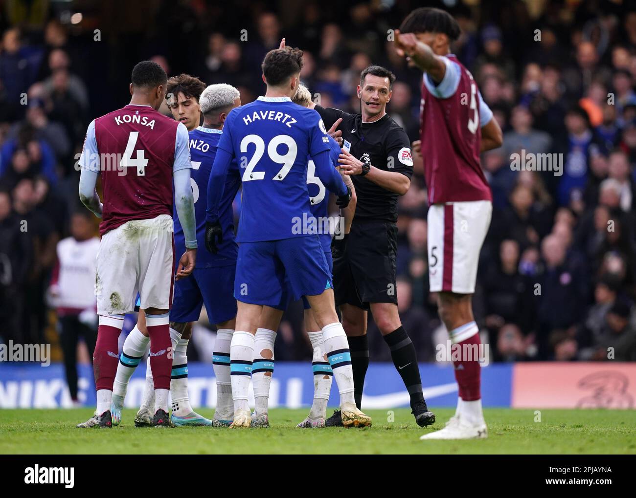 Chelsea players surround referee Andrew Madley during the Premier ...