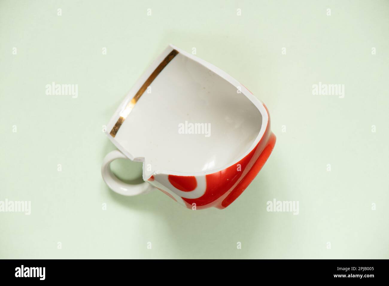broken cup close up on isolated light background, broken dishes Stock ...