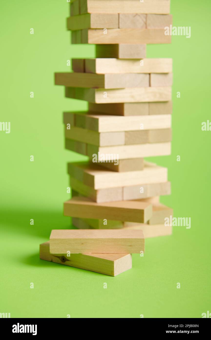 Wooden blocks on green background. Board games developing fine motor ...