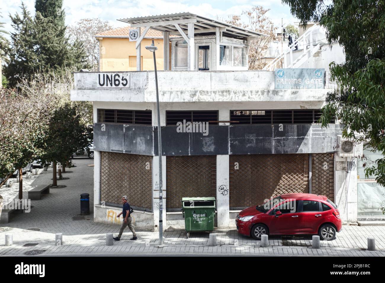 A man walks under a UN outpost near Paphos Gate, Nicosia on Apr. 1 ...