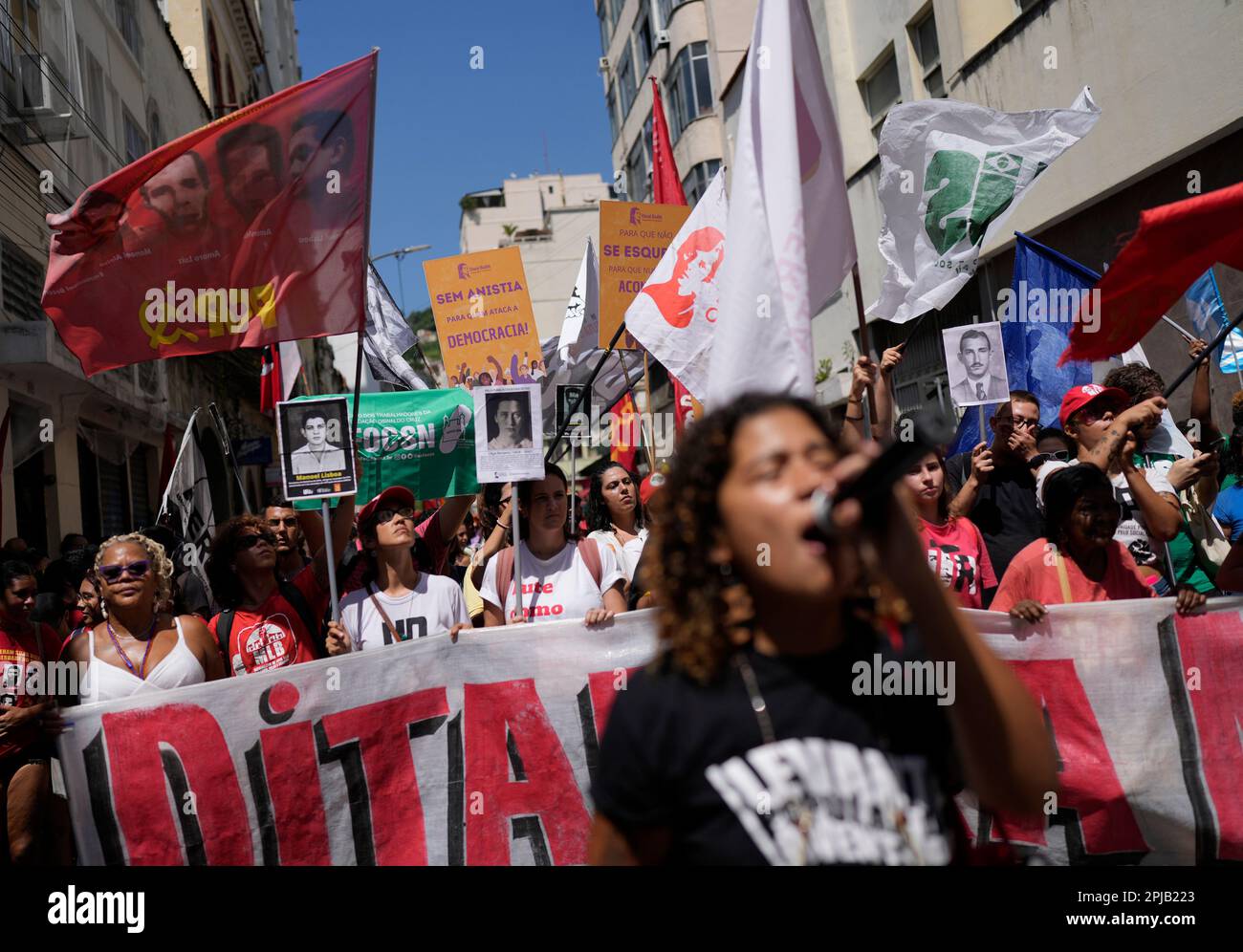 People march during a protest remembering the victims of the military ...
