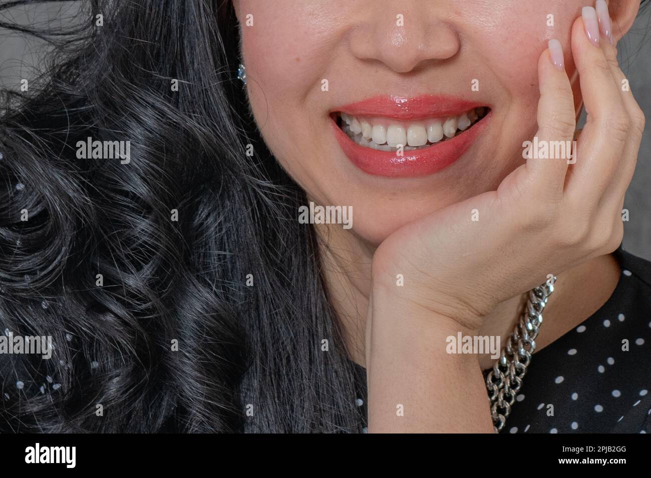 the smile of a girl with white teeth Stock Photo - Alamy