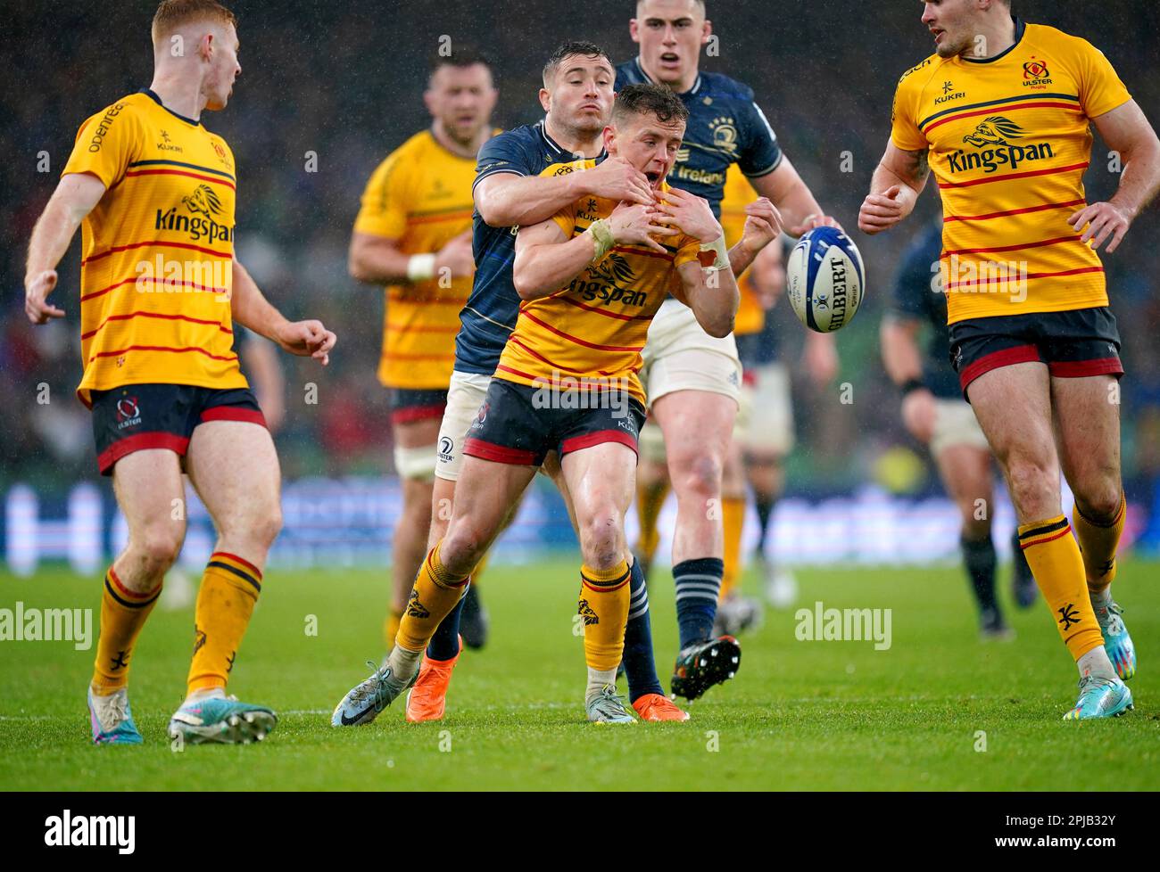 Ulster Rugby's Michael Lowry is tackled by Leinster Rugby's Jordan ...