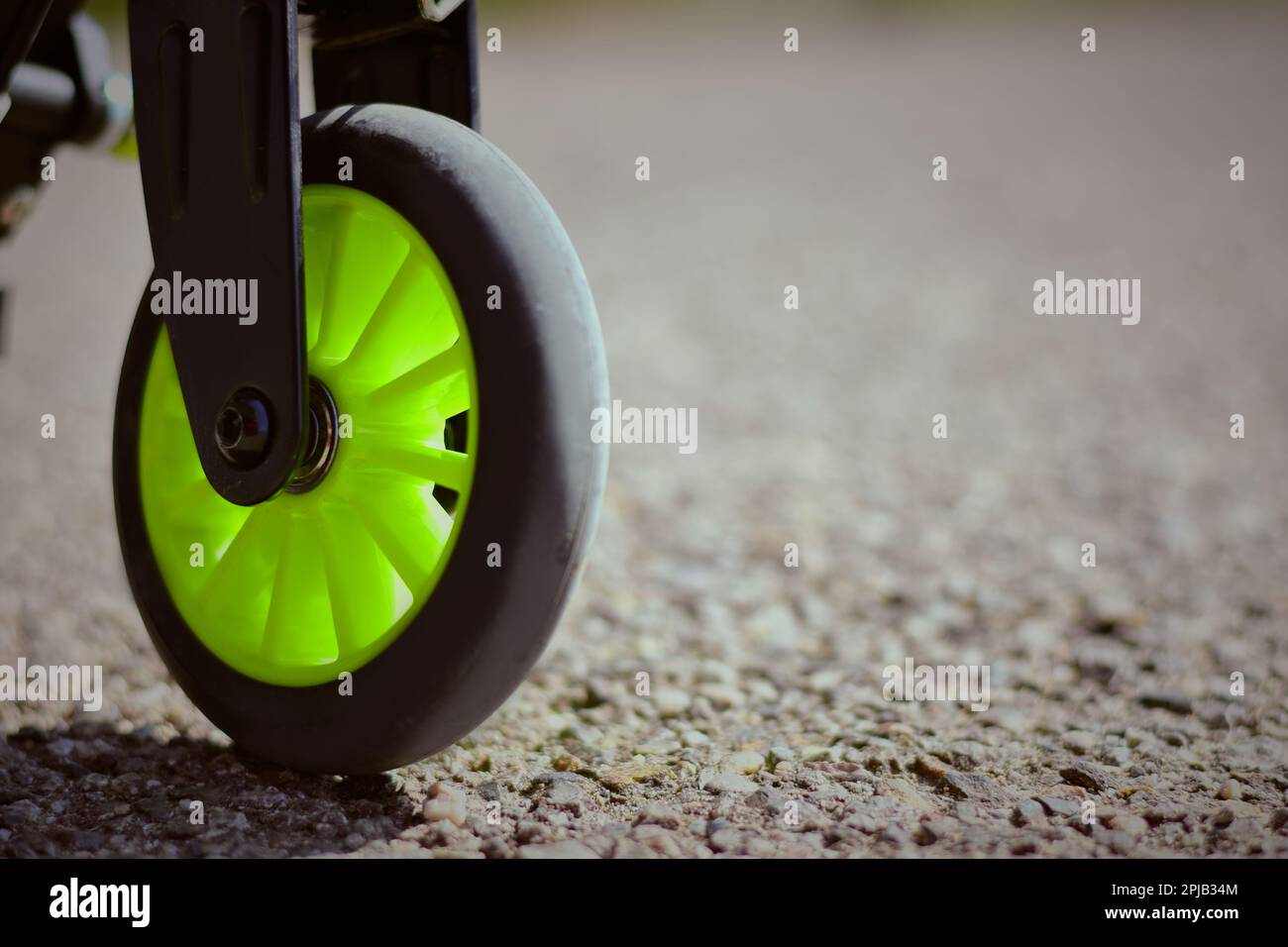 Rolling on Asphalt: A Close-Up View of the Scooter Wheel Stock Photo ...