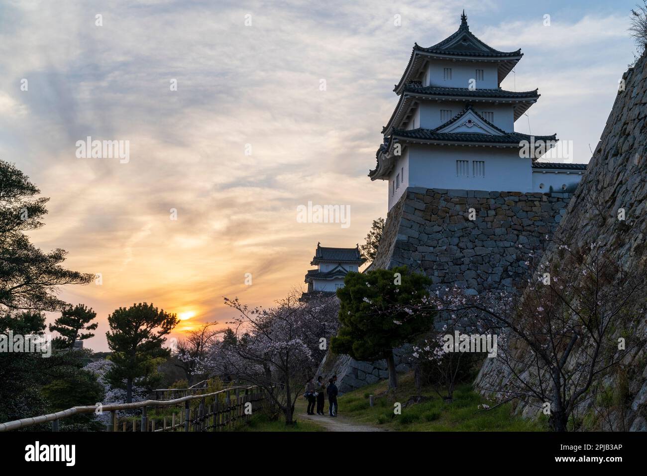 Sunset at Akashi castle in Japan. View along the two Edo Period yagura ...