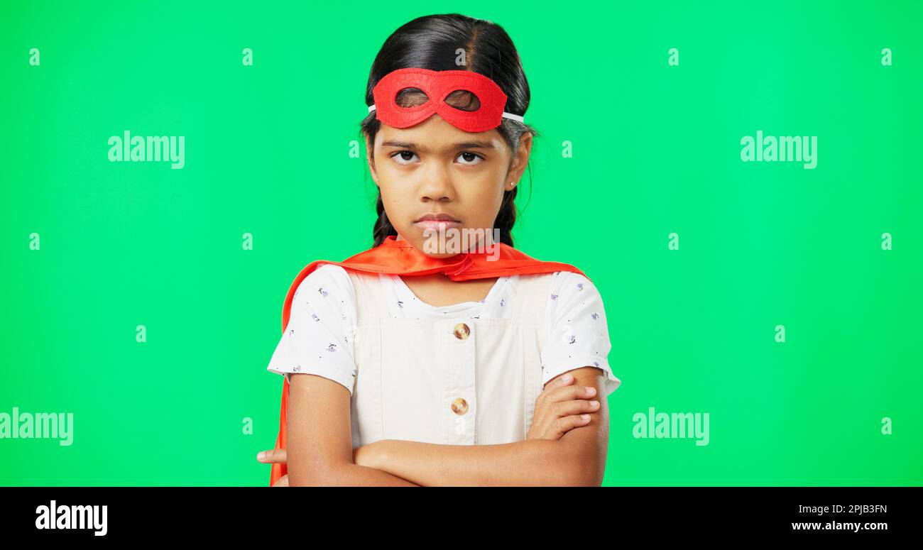 Angry, crossed arms and face of child on green screen with upset ...