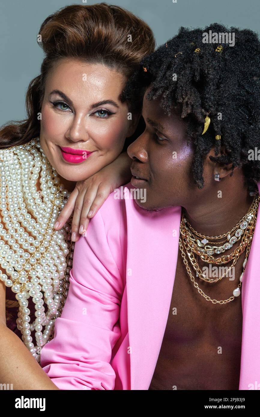 Models in bright outfits pose in the studio Stock Photo - Alamy