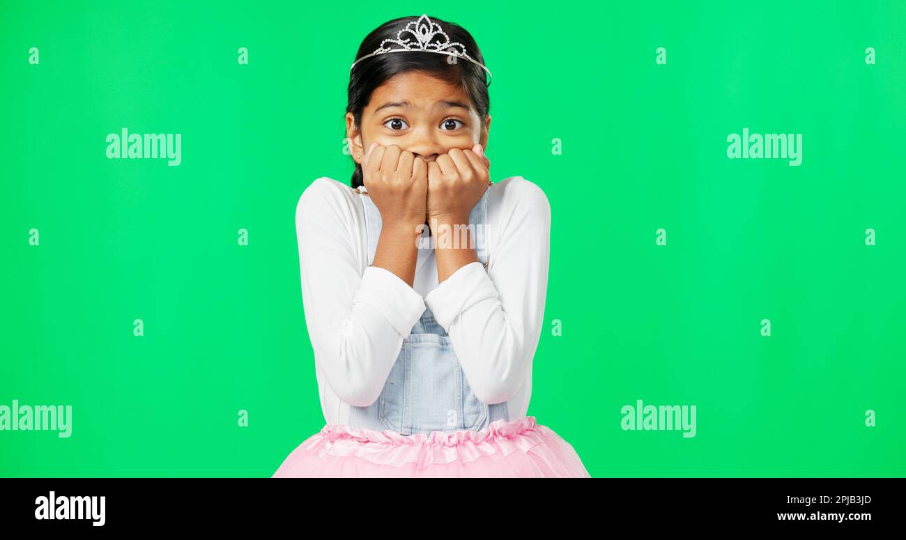 Scared, fear and child with anxiety on green screen with crown ...