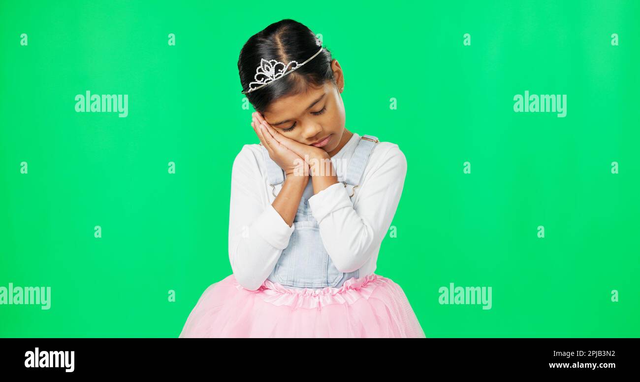 Sleeping, tired gesture and child on green screen with crown, princess ...