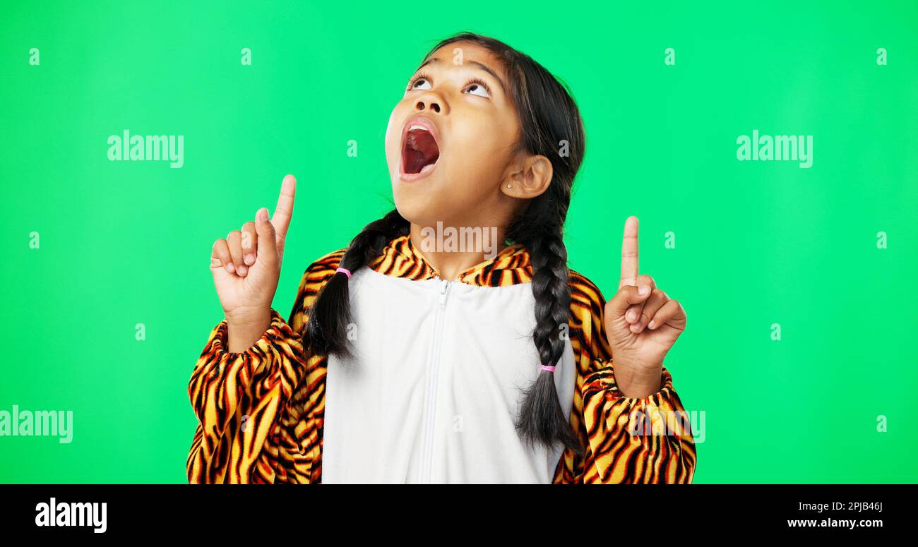 Shock, green screen and face of a child pointing isolated on a studio ...