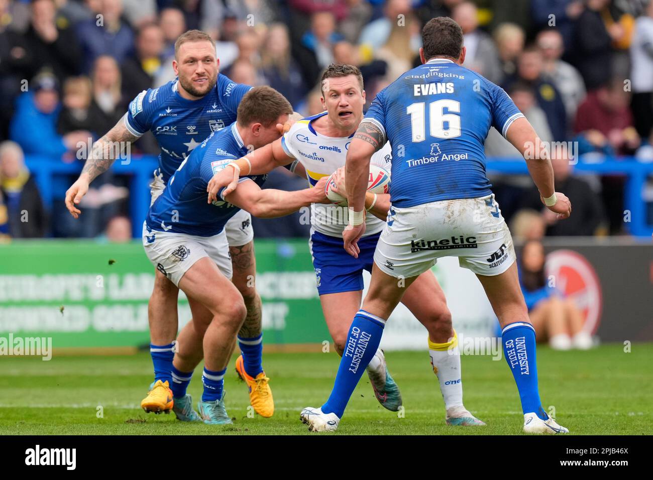 Josh Drinkwater #7 of Warrington Wolves runs at Kane Evans #16 of Hull ...