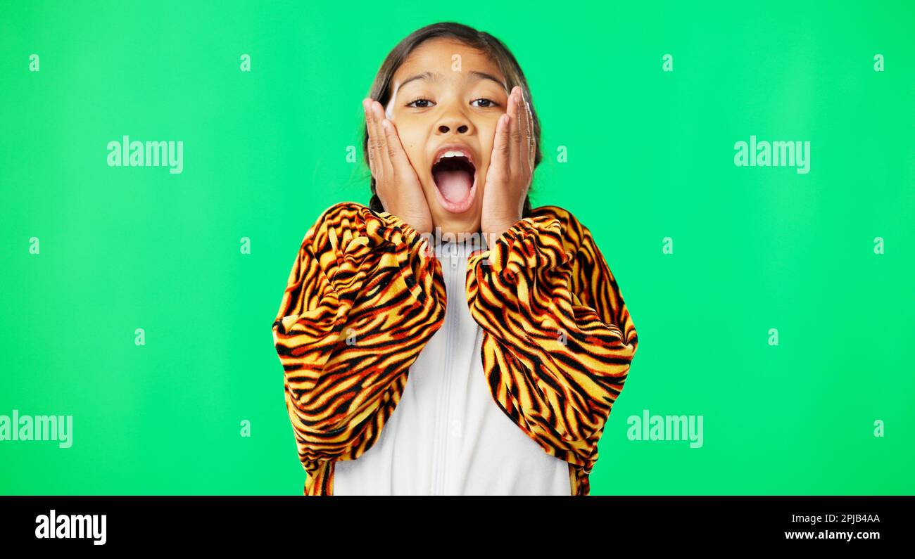 Girl child, shock face and green screen studio with tiger pyjamas ...