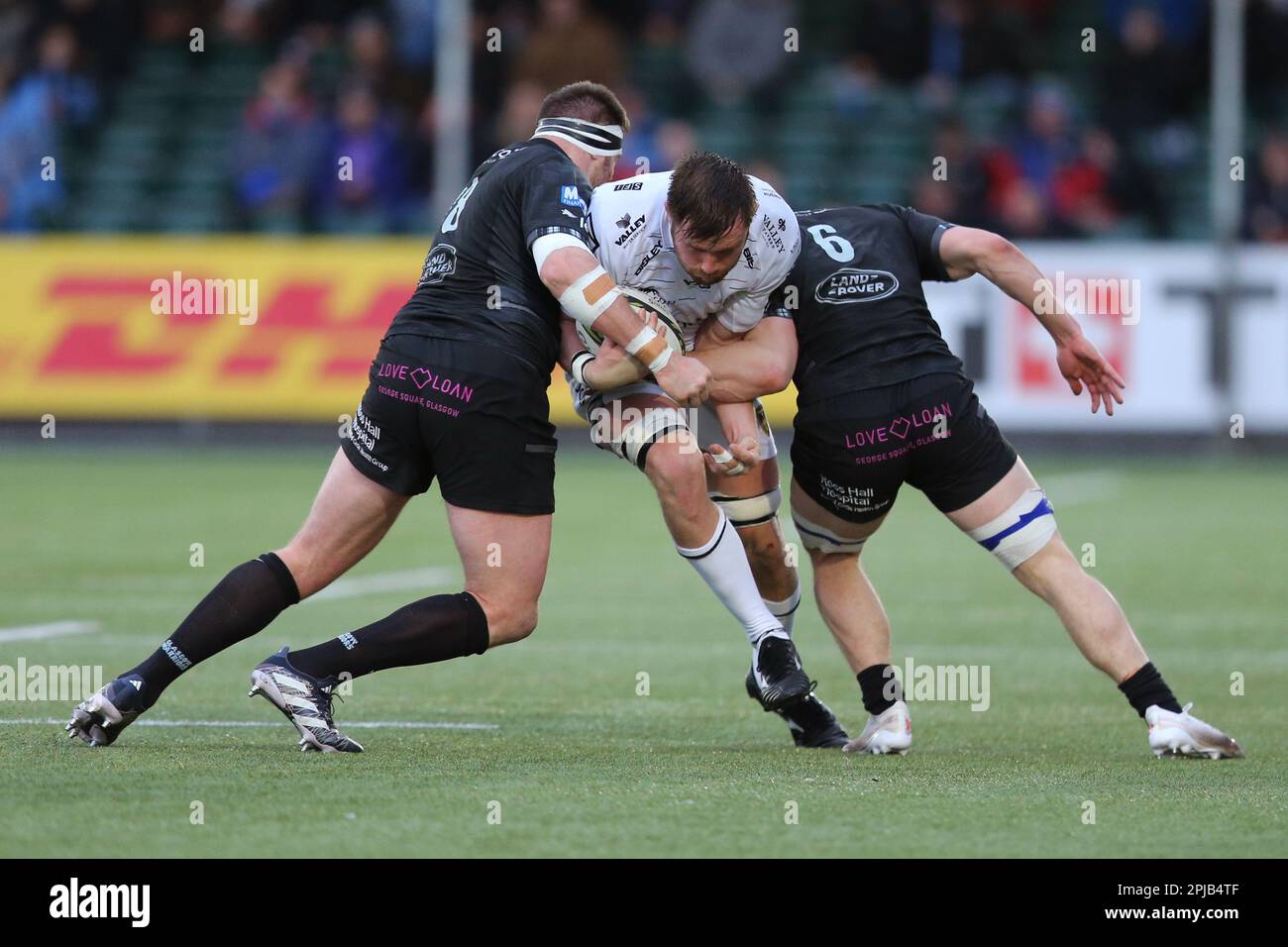 Dragons' George Nott (centre) battle for the ball with Glasgow Warriors ...