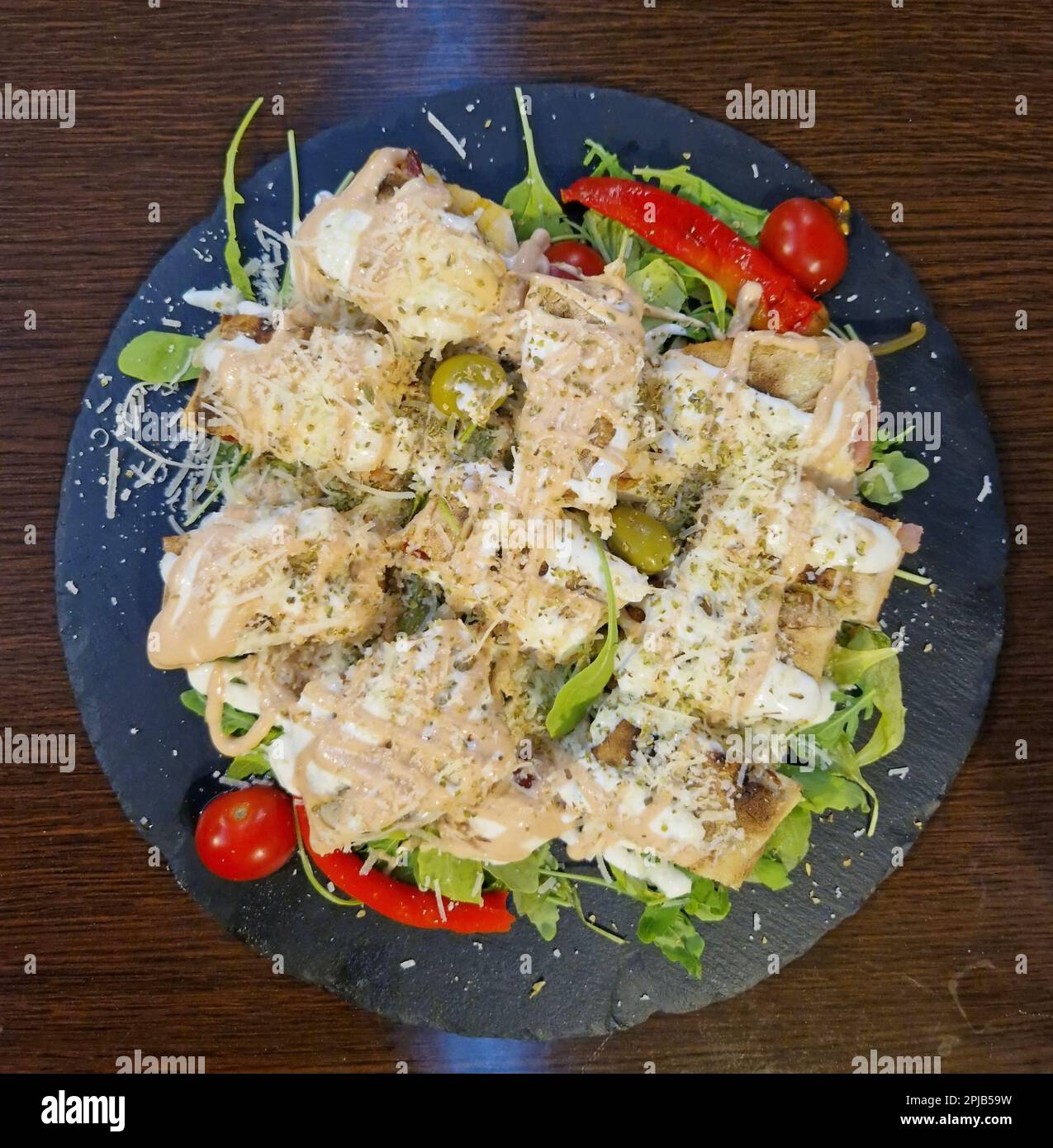 Delicious pizza stromboli roll stuffed with salami sausage, olives ...