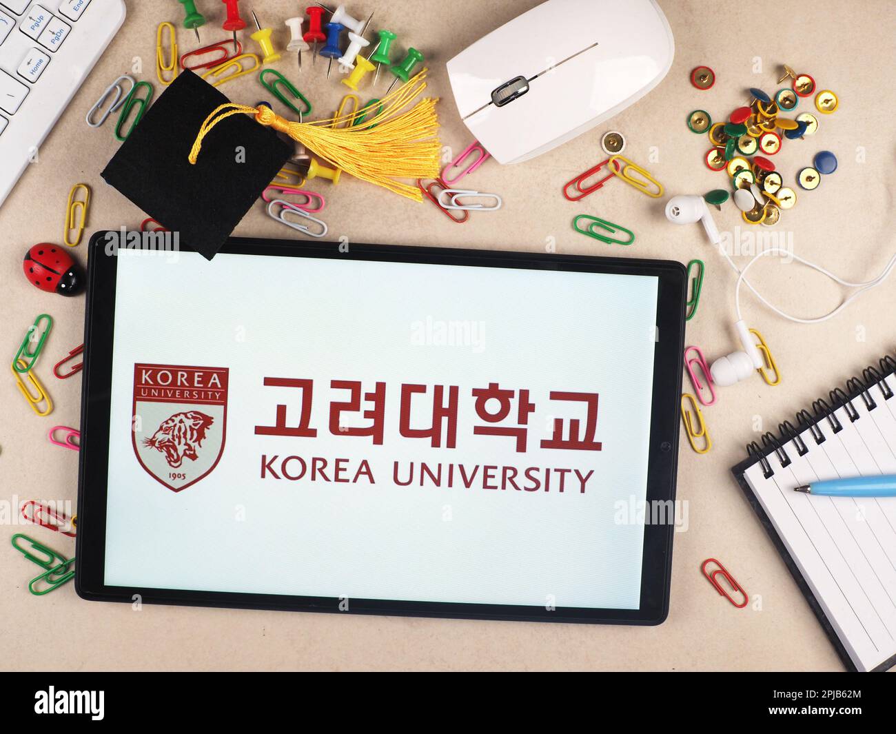 In this photo illustration, a Korea University logo seen displayed on a ...