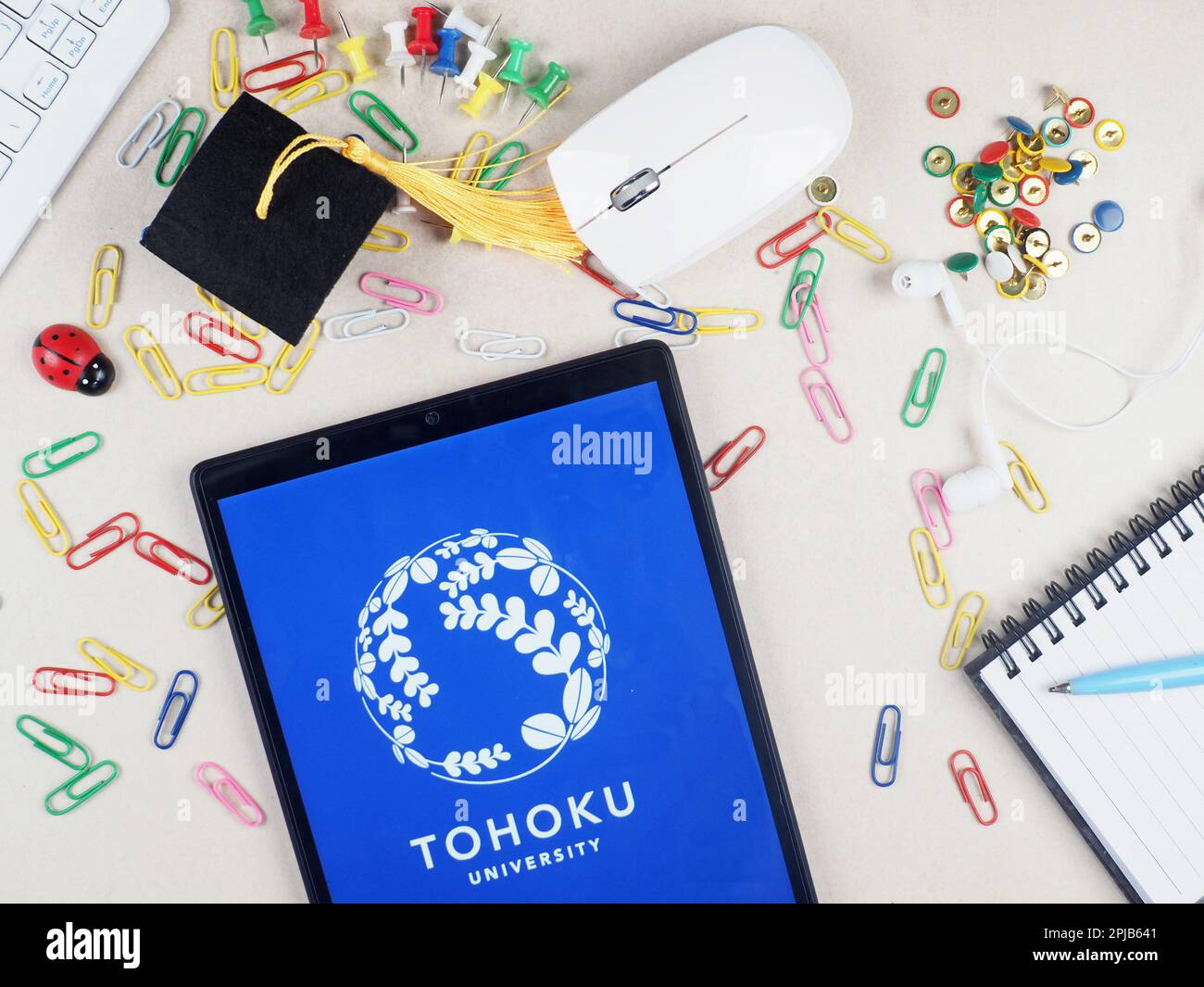 In this photo illustration, a Tohoku University logo seen displayed on ...