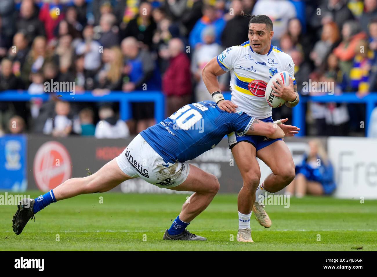 Scott Taylor #30 of Hull FC tacklesPete Mata’utia #3 of Warrington ...