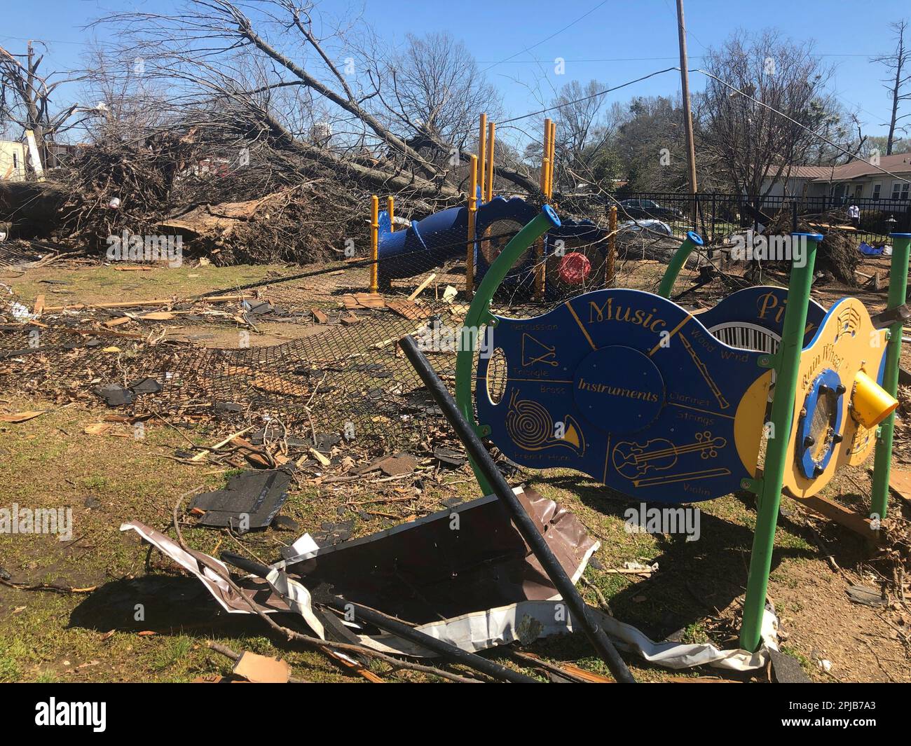 Debris covers the ground around a damaged church playground in Wynne ...