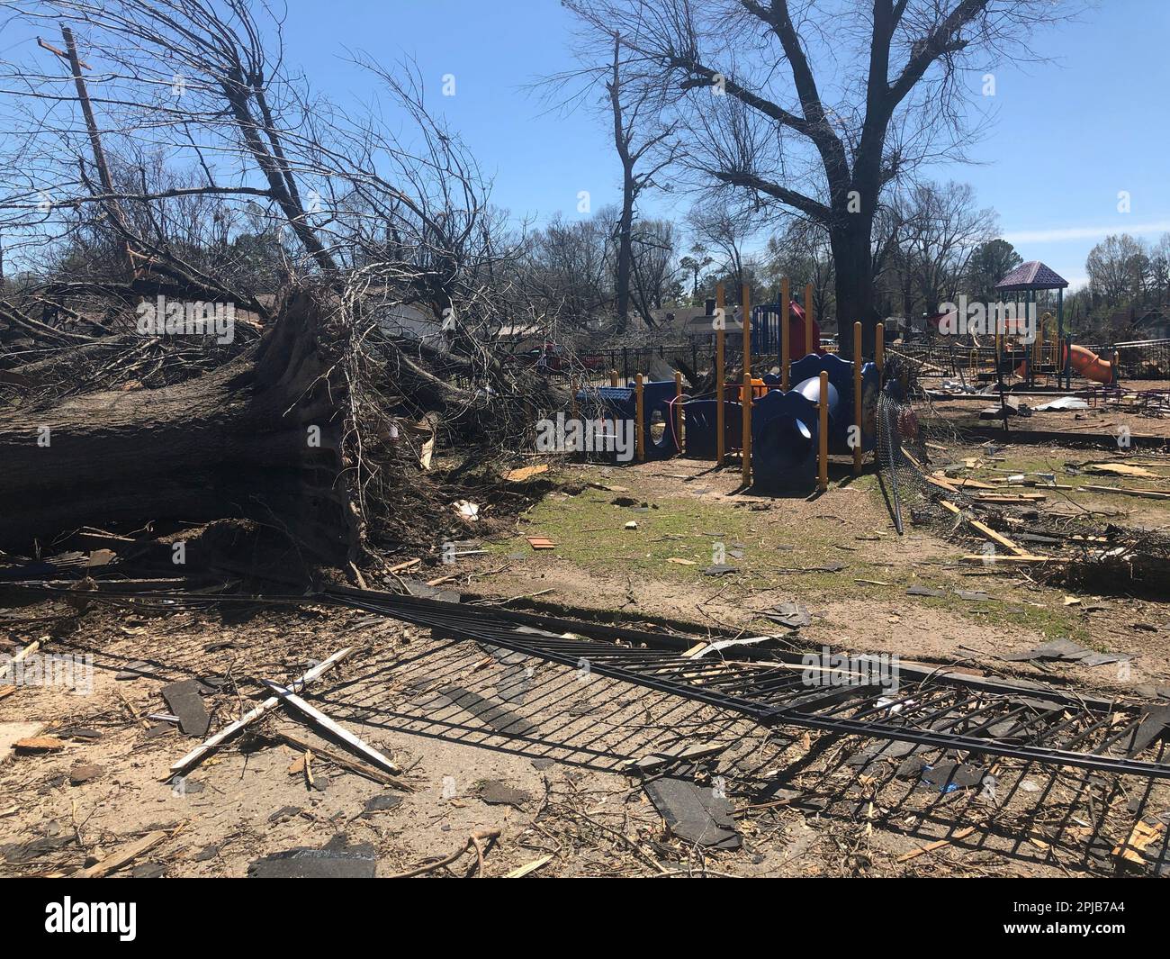 Debris covers the ground around a damaged church playground in Wynne ...