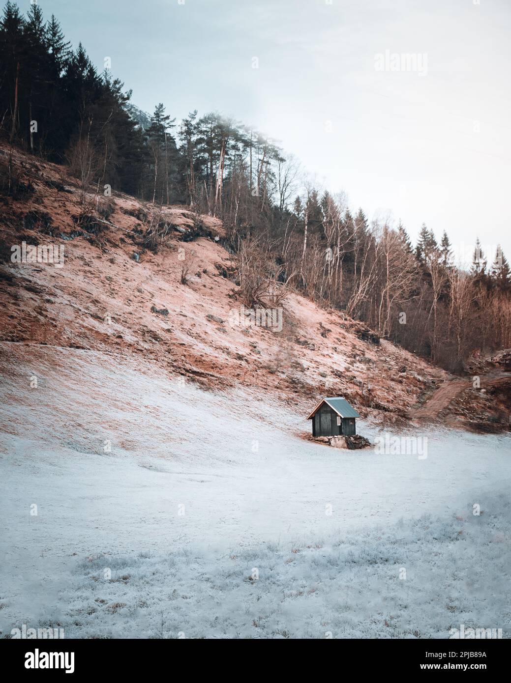 An exterior view of a single-story house in a rural mountain Stock ...