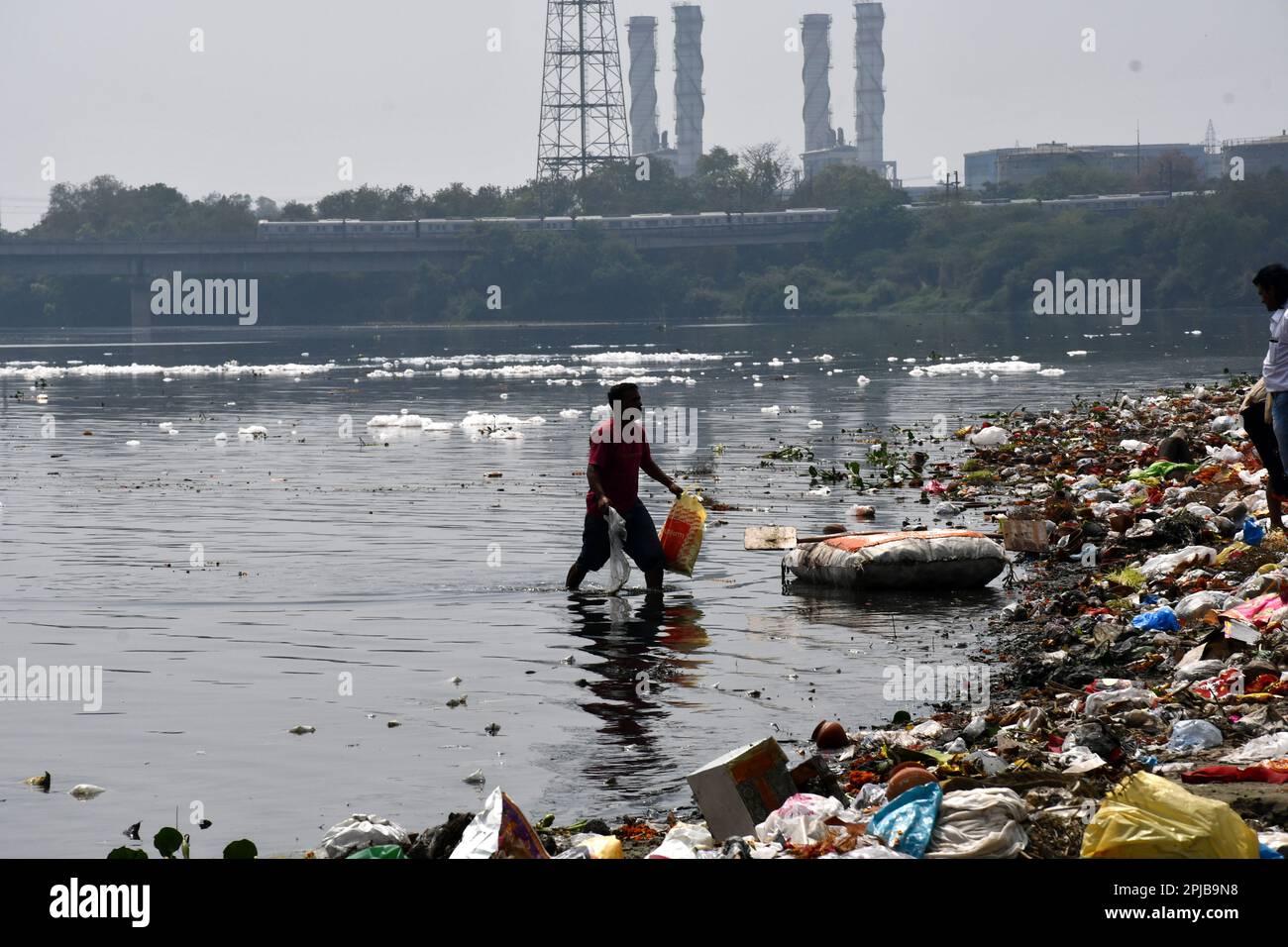 New Delhi, India. 1st Apr, 2023. Polluted Yamuna river with trash and ...