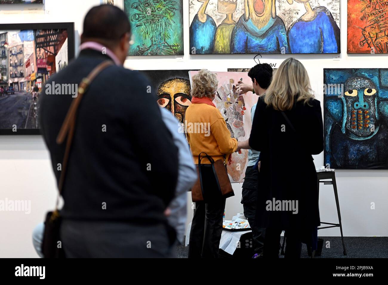 People watch as sixteen year-old prodigy Aarav Verma paints live during ...