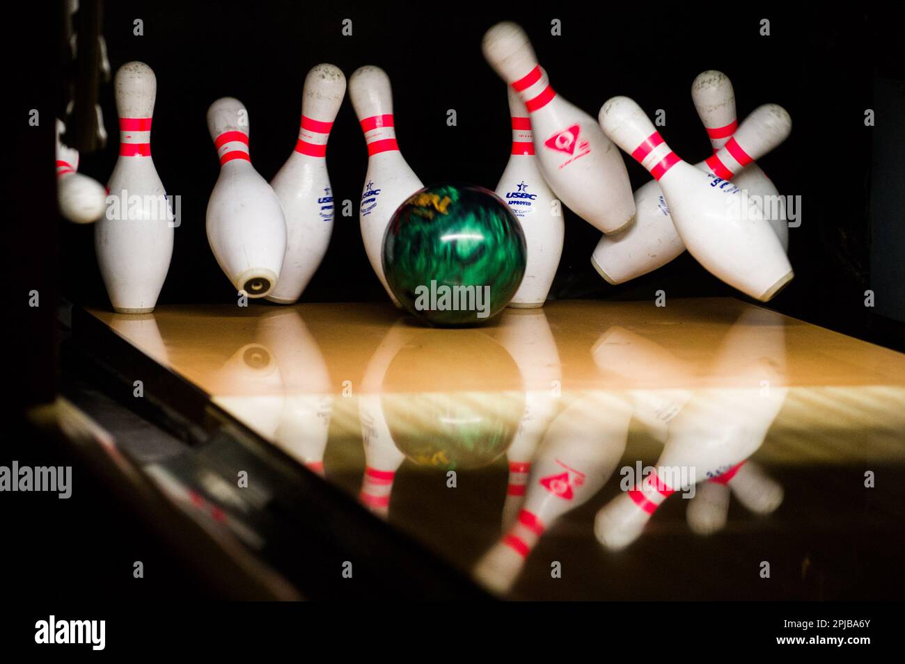 Bowling ball crashing into pins in OHIO USA Stock Photo - Alamy