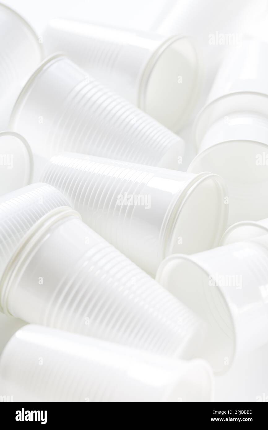 Disposable white plastic cups as background. Environmental concept. Non ...