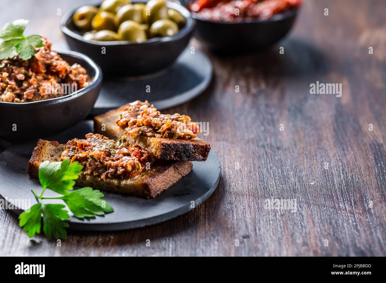Crispy crostini with tapenade and ingredients. Tapenade - delicious ...