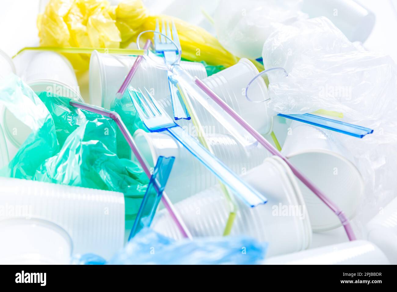 Assortment of disposable plastic, cups, cutlery, bags and drinking ...