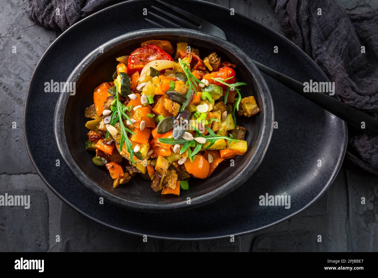 Low carb salad of grilled vegetables with rocket (arugula) and seeds ...