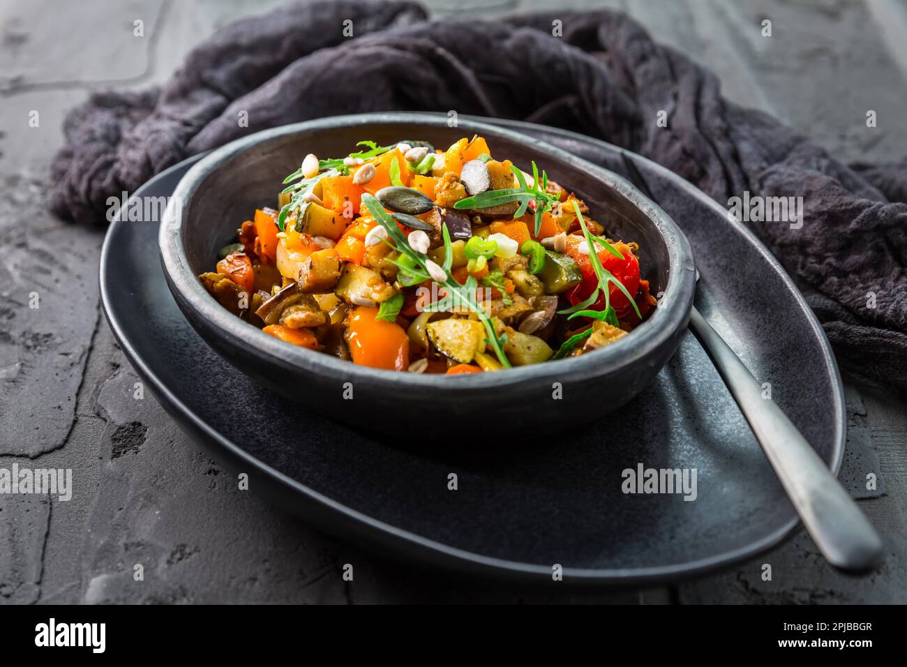 Low carb salad of grilled vegetables with rocket (arugula) and seeds ...