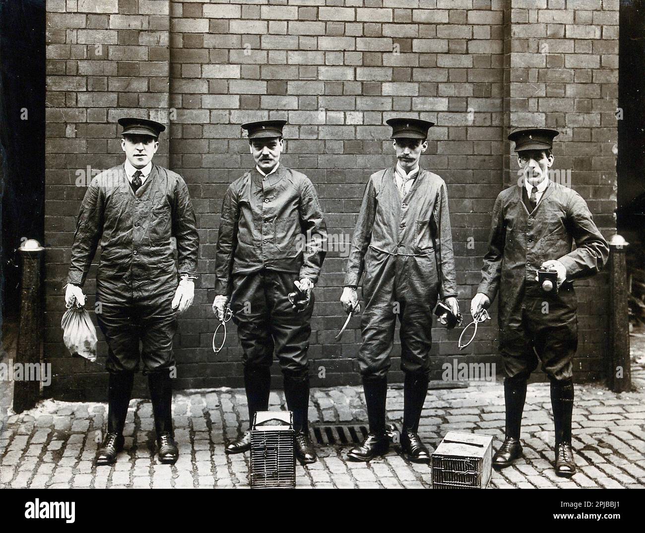 Liverpool Port Sanitary Authority rat catchers dressed in protective ...