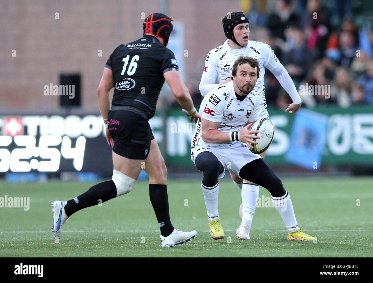 Dragons' Rhodri Williams (right) in action during the EPCR Challenge ...