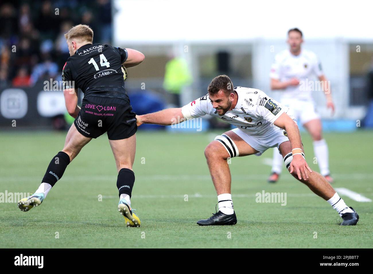 Glasgow Warriors' Kyle Steyn (left) attempts to get past Dragons' Sean ...