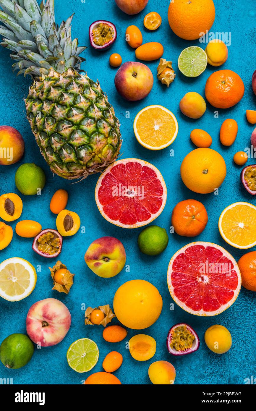 Flat Lay Layout Of Summer And Citrus Fruits On Blue Background Healthy Eating Concept Stock